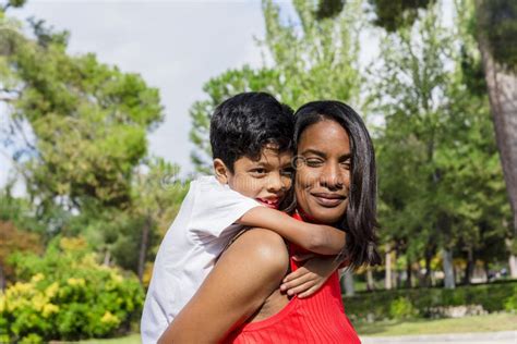 Happy Mother And Son Enjoying Together Outdoors In A Park Stock Image Image Of Smiling Grass