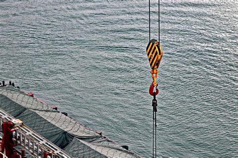 Loading Bulk Cargo Of Limestone From Barges Into A Bulk Carrier By Using Ship Cranes And Grabs