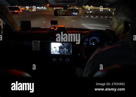 Passengers Pov From Backseat Of A Car Driving At Night In Bangkok