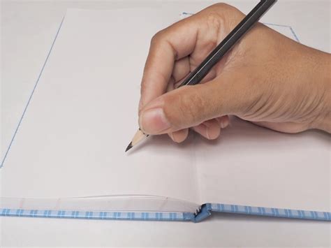 Premium Photo Close Up Of Hand Writing In Book
