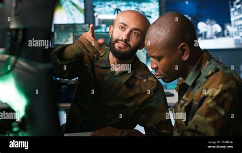 Army Unit Working In Governmental Facility Next To Coworker Doing Brainstorming Operating