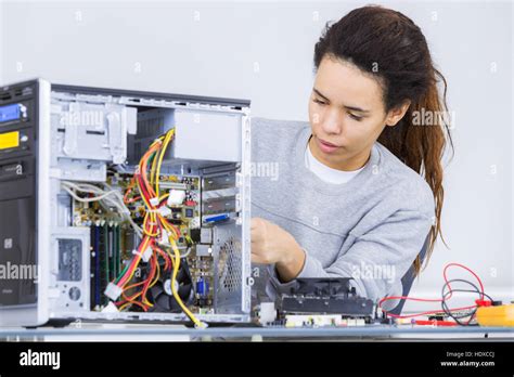 Woman Repairing Computer Stock Photo Alamy