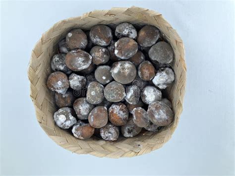 A Pile Of Several Duku Fruits Have Rotted With The Characteristic Of White Mold And Black Skin