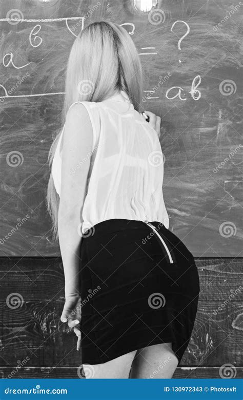 Woman With Nice Buttocks Teaching Mathematics Rear View Of Young