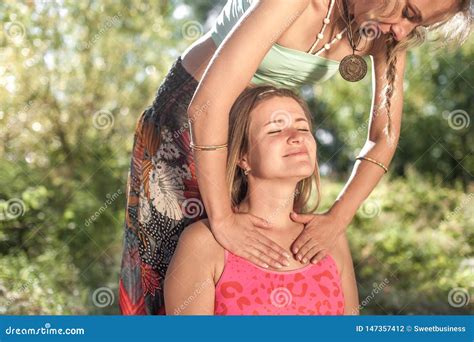 Healer Demonstrates Refreshing Massaging Methods On The Grass Of The