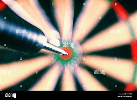 Dart In Bullseye Of Dartboard Stock Photo Alamy