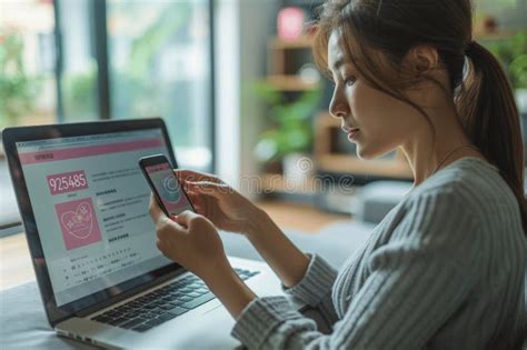 Young Woman Using Smartphone And Laptop For Secure Two Factor