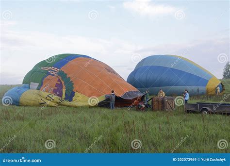 Hot Air Balloons Getting Ready For Flight Car And Trailer With