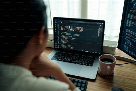 Close Up Of Programmer Coding At Desk Photo Technology Image On Unsplash