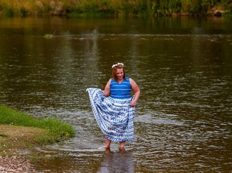 Premium Photo Smiling Young Woman Standing In River