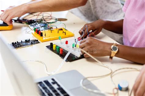 Close Up View Of Young Students Learning Electronic Circuit System At