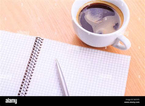 Open Blank Note Book With Coffee Cup And A Pen On Wood Table Stock Photo Alamy