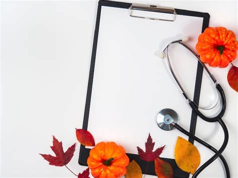Premium Photo Stethascope With A Tablet Leaves Pumpkins And Other