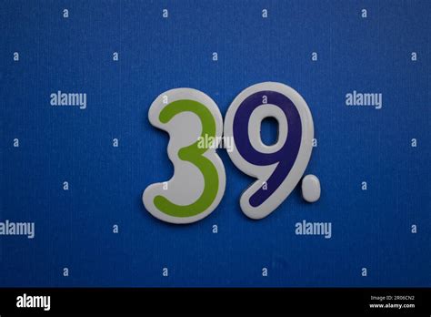 The Number 39 Placed On A Blue Background Photographed From Above