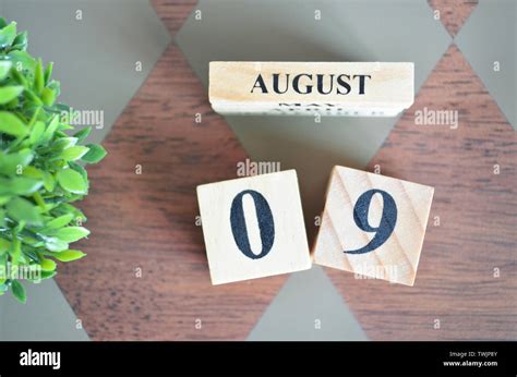 Date Of August With Leaf On Diamond Pattern Table For Background Stock
