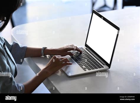 Side View Of Young Woman Hands Typing On Mock Up Laptop Computer White