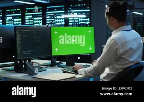 Programmer Overseeing Data Center Using Isolated Screen Computer Ensuring System Can Handle