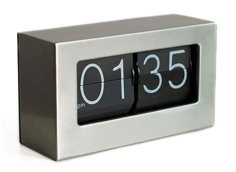 A 1970s Style Analog Flip Clock In A Stainless Steel Case