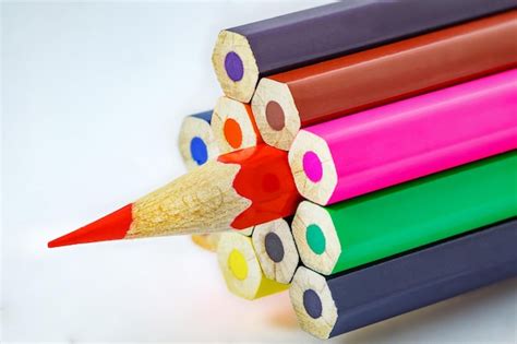 Premium Photo Colored Pencils Ends Are Not Sharpened Red Pencil Sharpened On White Background