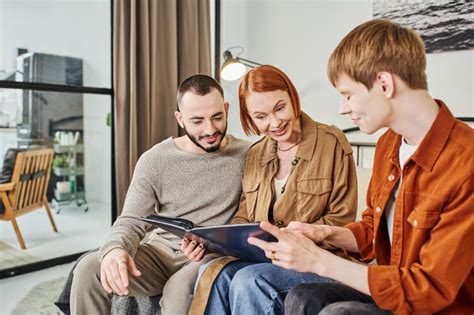 Redhead Gay Man Showing Photo Album Stock Image Image Of Home Young