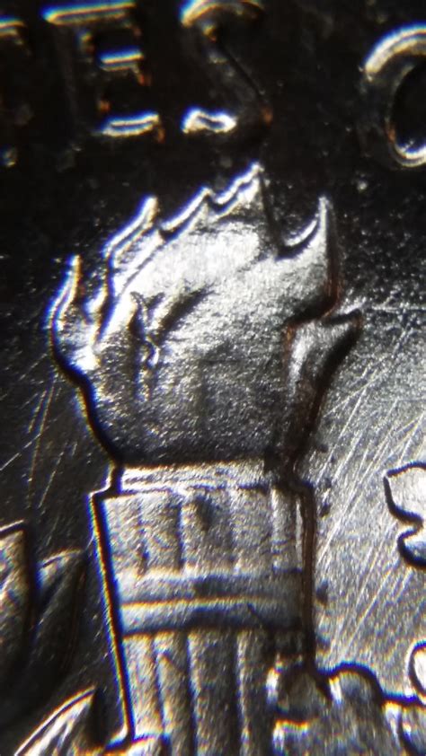 Anyone Ever See This On 1963 10c Torch — Collectors Universe