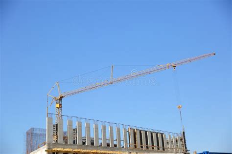 A Construction Crane Is A Tool For Carrying Large Building Materials To High Heights Stock