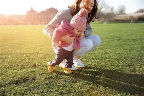 Free Photo Full Shot Parent And Baby Walking Together In Nature