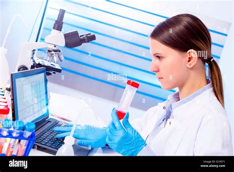 MODEL RELEASED Female Lab Technician Holding Test Tube In Laboratory Stock Photo Alamy