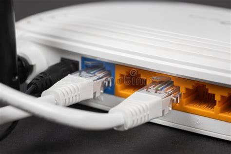 Connect An Ethernet Cable To A Wireless Router On Dark Ethernet Rj45 And Electric Cables