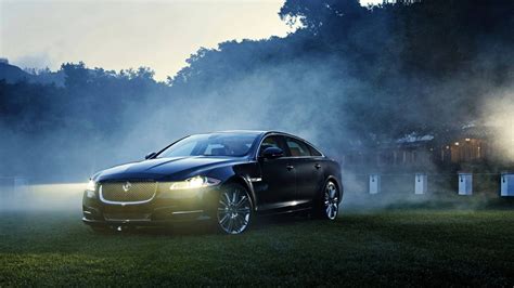 Download Smoky Front Black Jaguar Car Wallpaper