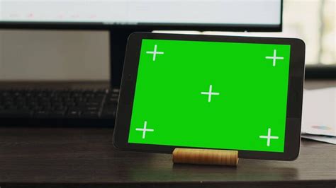 Empty Desk With Greenscreen On Tablet In Business Coworking Space Isolated Copyspace Layout On