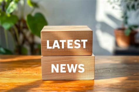 Latest News Message Written On Wooden Blocks On Table Conceptual