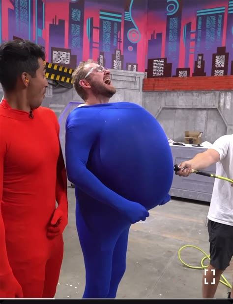 Two Guys Inflated In Morph Suits 日本語で