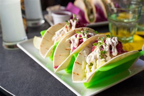 Set Of Delicious Tacos On Plastic Rack Mexican Cafe Stock Image