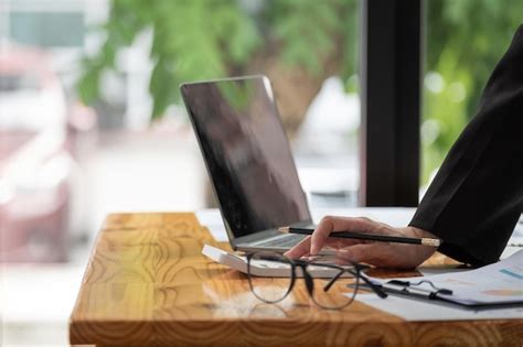 Premium Photo Man Using Laptop On Table
