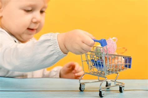 Premium Photo Cute Chick In A Trolley With Eggs