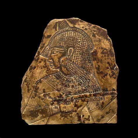 replica of an ancient egyptian limestone fragment of a musician woman