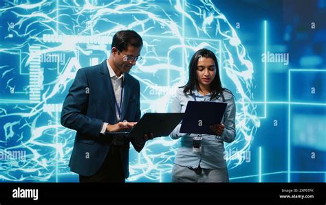 Ai Researcher And Coworker Working With Artificial Intelligence Neural Networks Computer