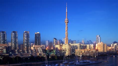 Torontos Cn Tower Reimagined As Residential High Rise Covered In