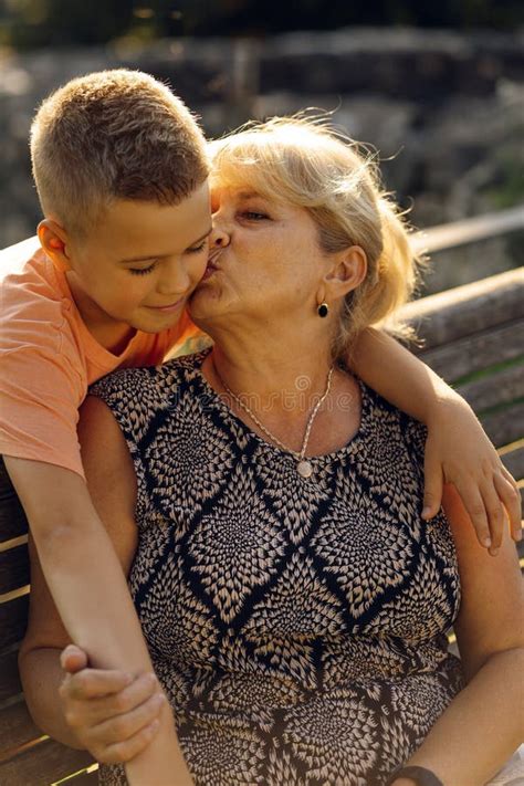 Happy Grandmother With Grandson Together Grandmother Kisses Her Grandson Stock Image Image Of