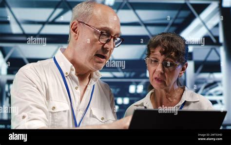 It Programmers In Data Center Using Laptop To Monitor Energy Efficient