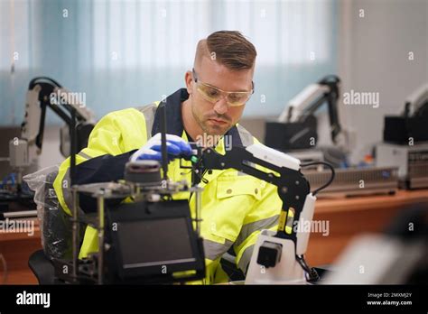 Engineers Maintenance Robot Arm At Lab In A High Tech Research