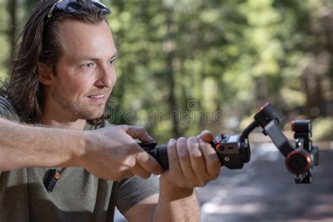 Young Man Filming With A Phone Gimbal Stock Image Image Of Fitness Cool 311702213