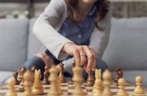 Premium Photo Woman Playing Chess And Moving A Piece