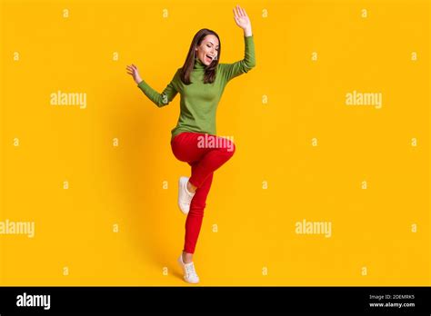 Full Length Body Size View Of Nice Careless Cheerful Girl Jumping