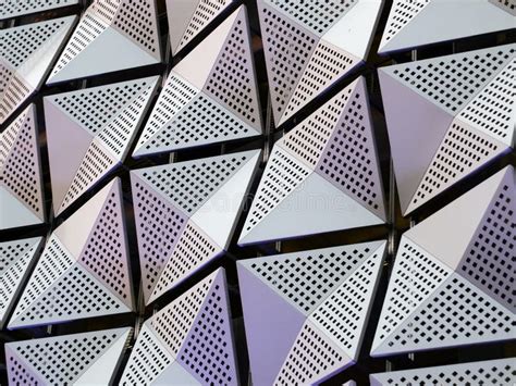 Silver Geometric Steel Cladding With Angular Patterns Stock Image