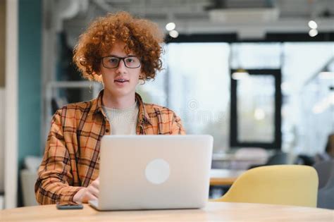 Male Programmer Wear Spectacles For Eyes Protection While Working On Freelance Via Laptop
