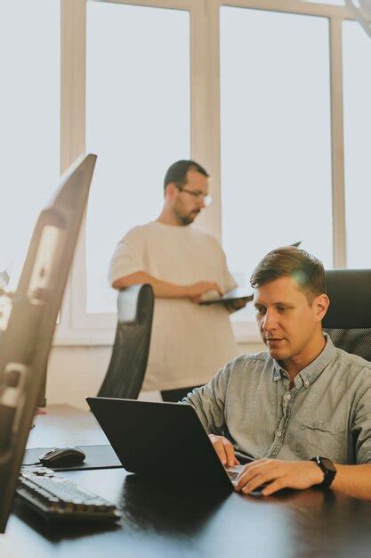 Premium Photo Portrait Of Two Professional Male Programmers Working