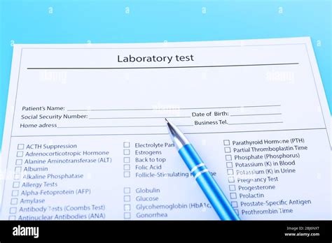 Laboratory Test List With Pen On Blue Background Close Up Stock Photo Alamy
