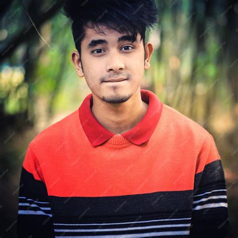 Premium Photo Portrait Of Young Man Biting Lips